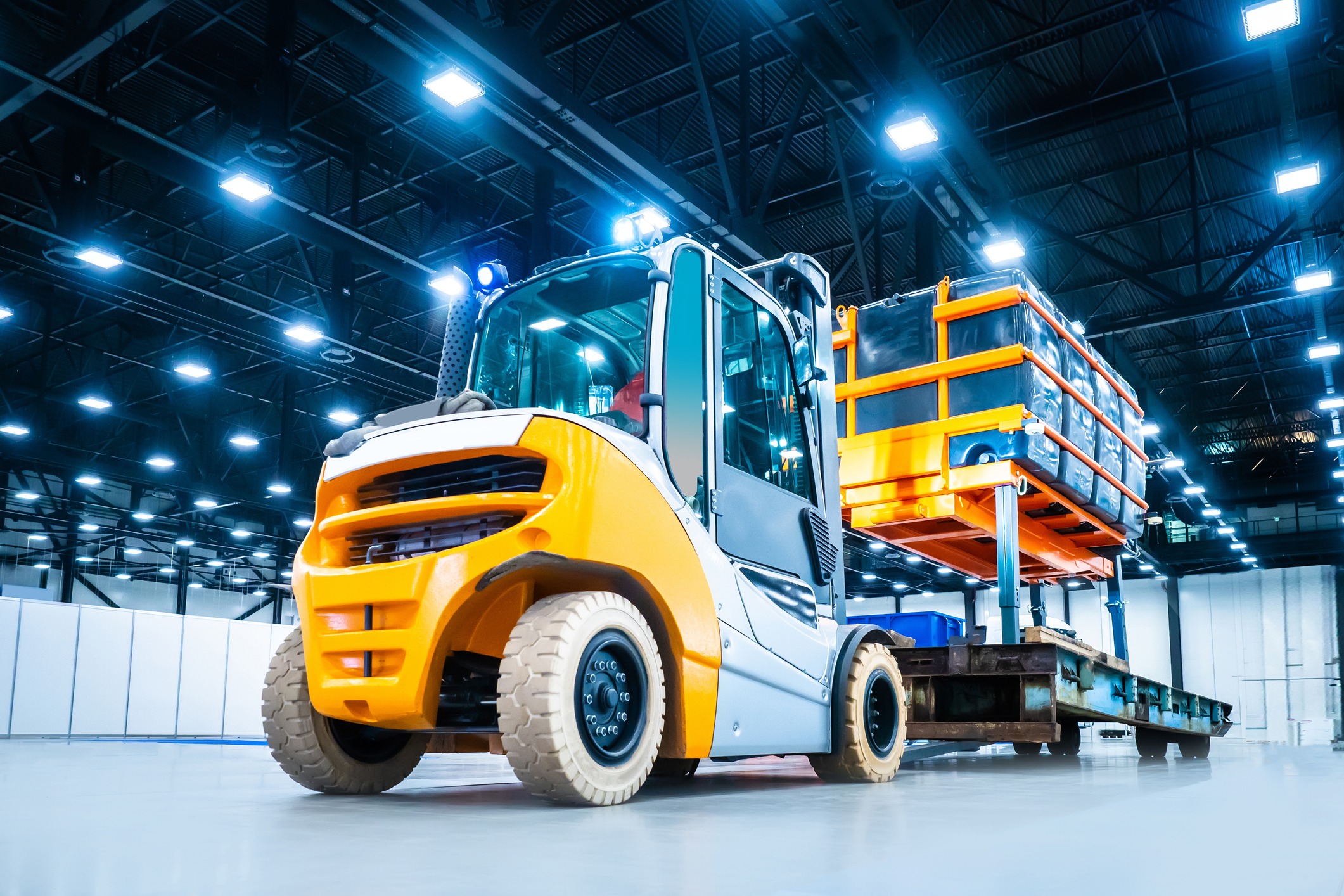 Diesel loader carries industrial lift with a load. Warehouse loader for ...